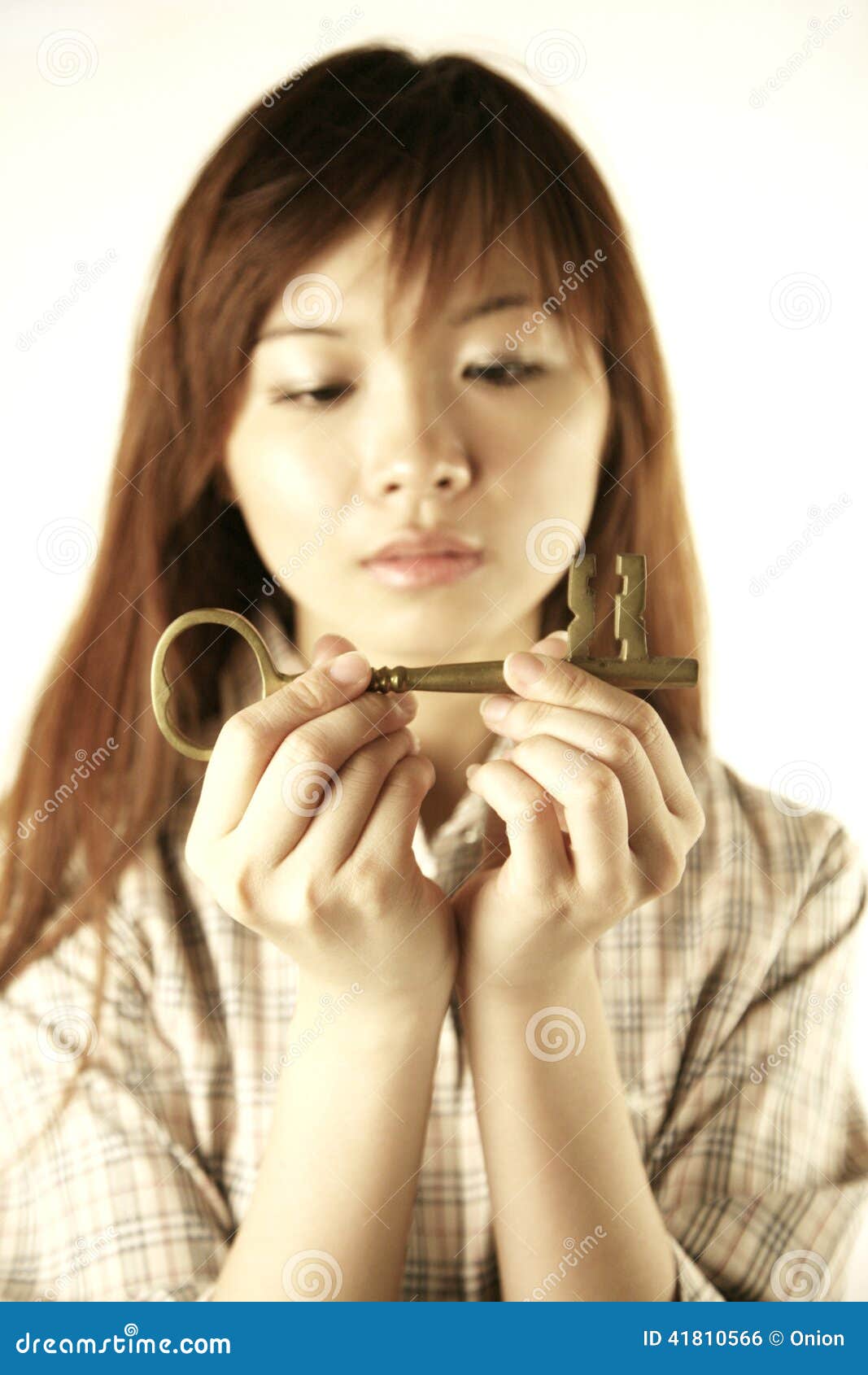 Asian girl holding key stock photo. Image of show, lock - 41810566