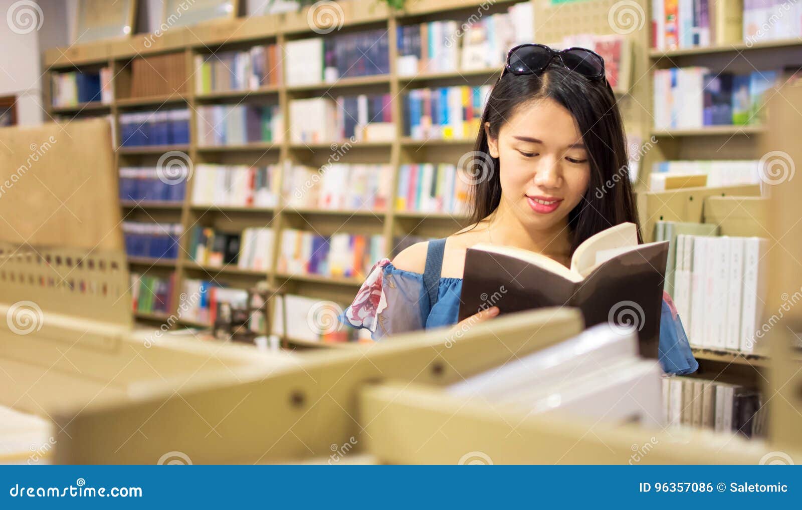 Asian Girl Reading in a Bookstore Stock Photo - Image of educational ...