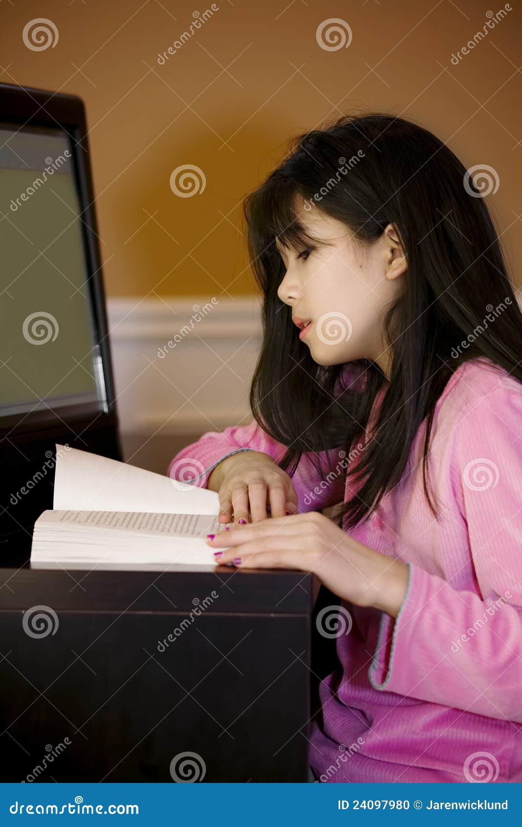 Asian Girl Reading at Desk, by Computer Stock Photo - Image of girl ...
