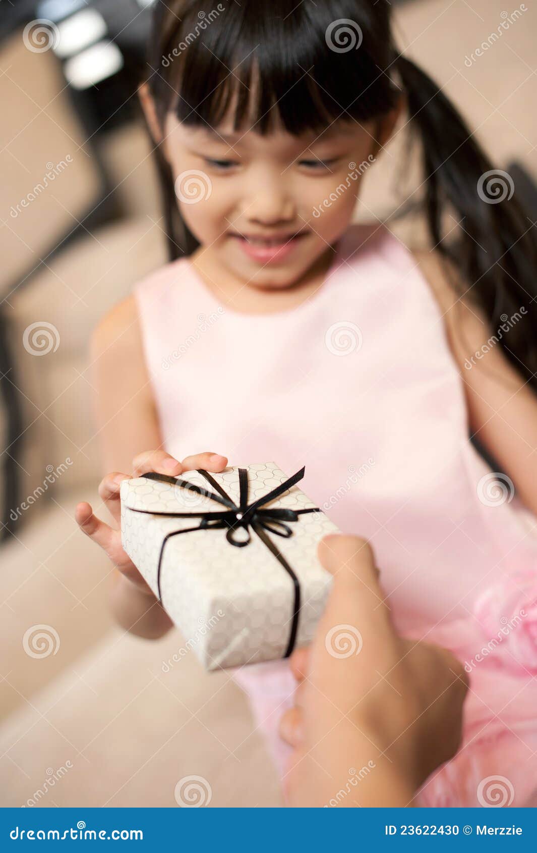 Asian Girl Receiving Gift stock photo. Image of home - 23622430