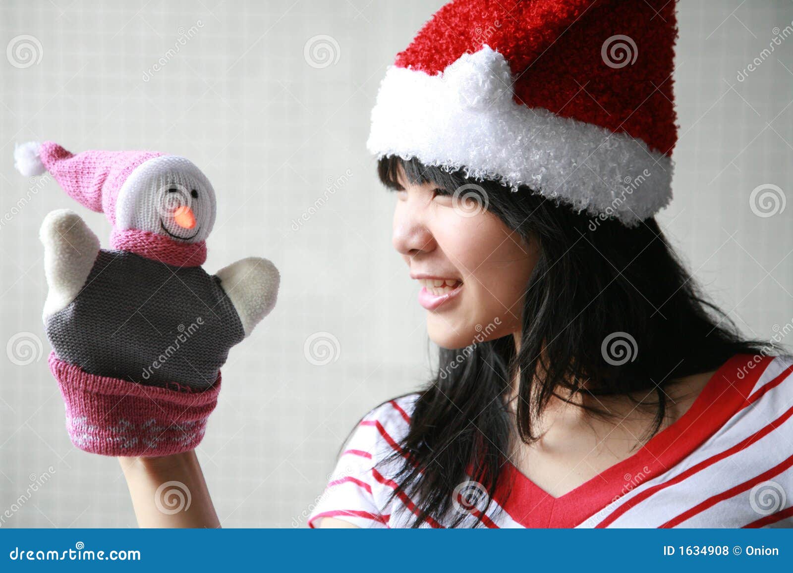 Asian Girl with Santa Hat Holding a Puppet Stock Photo - Image of ...