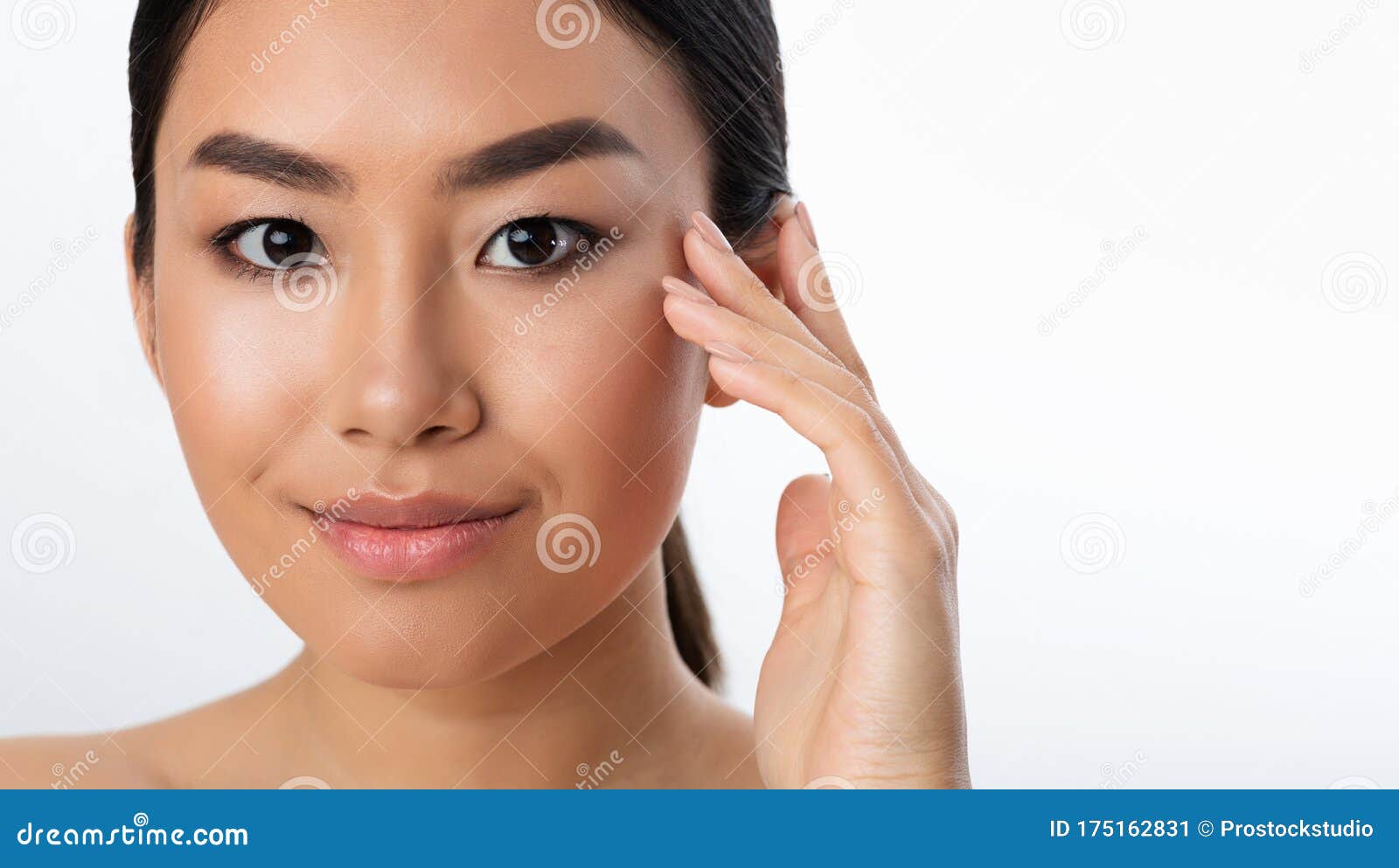 Asian Girl Touching Smooth Skin Posing Over White Background Stock