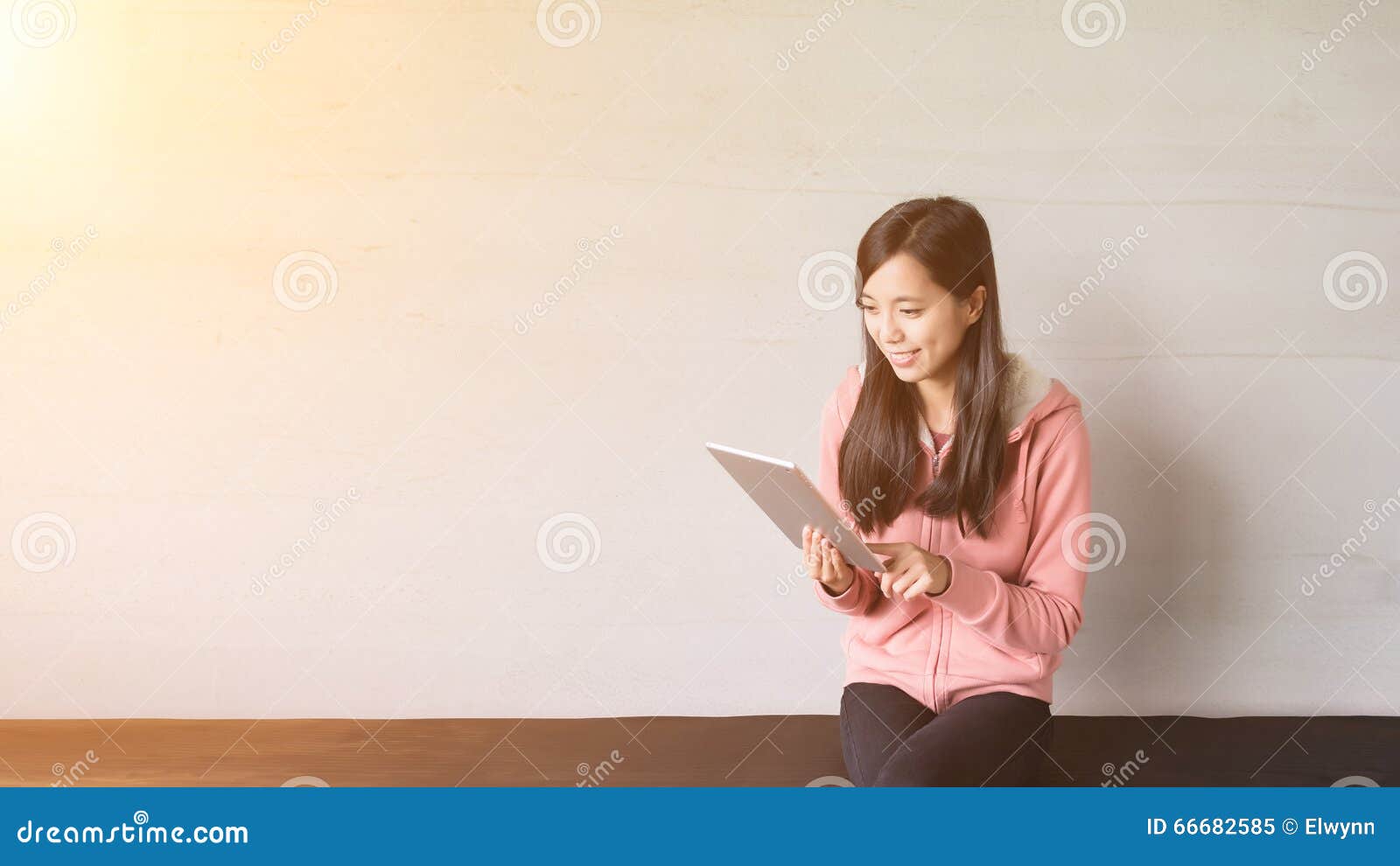 Asian girl use pad at home stock image. Image of female - 66682585