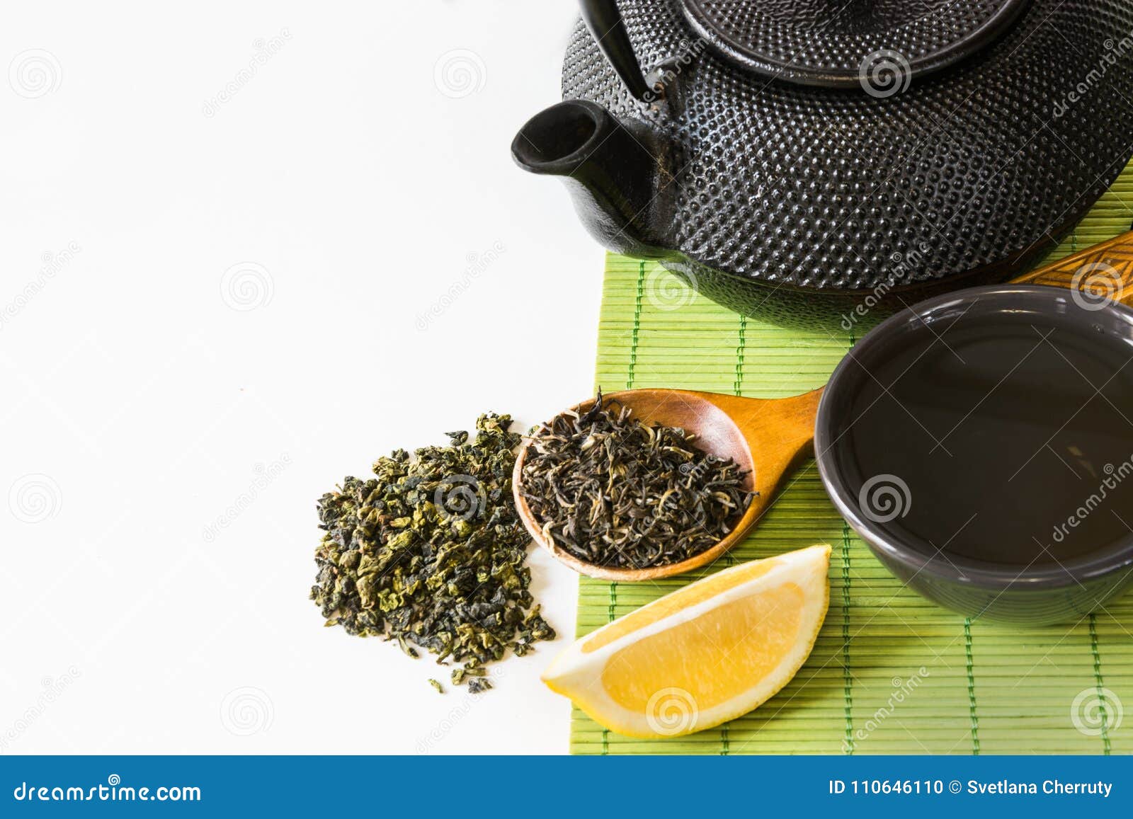 Asian Green Tea Set on Bamboo Mat with Dried Green Tea in Spoon. Asian ...