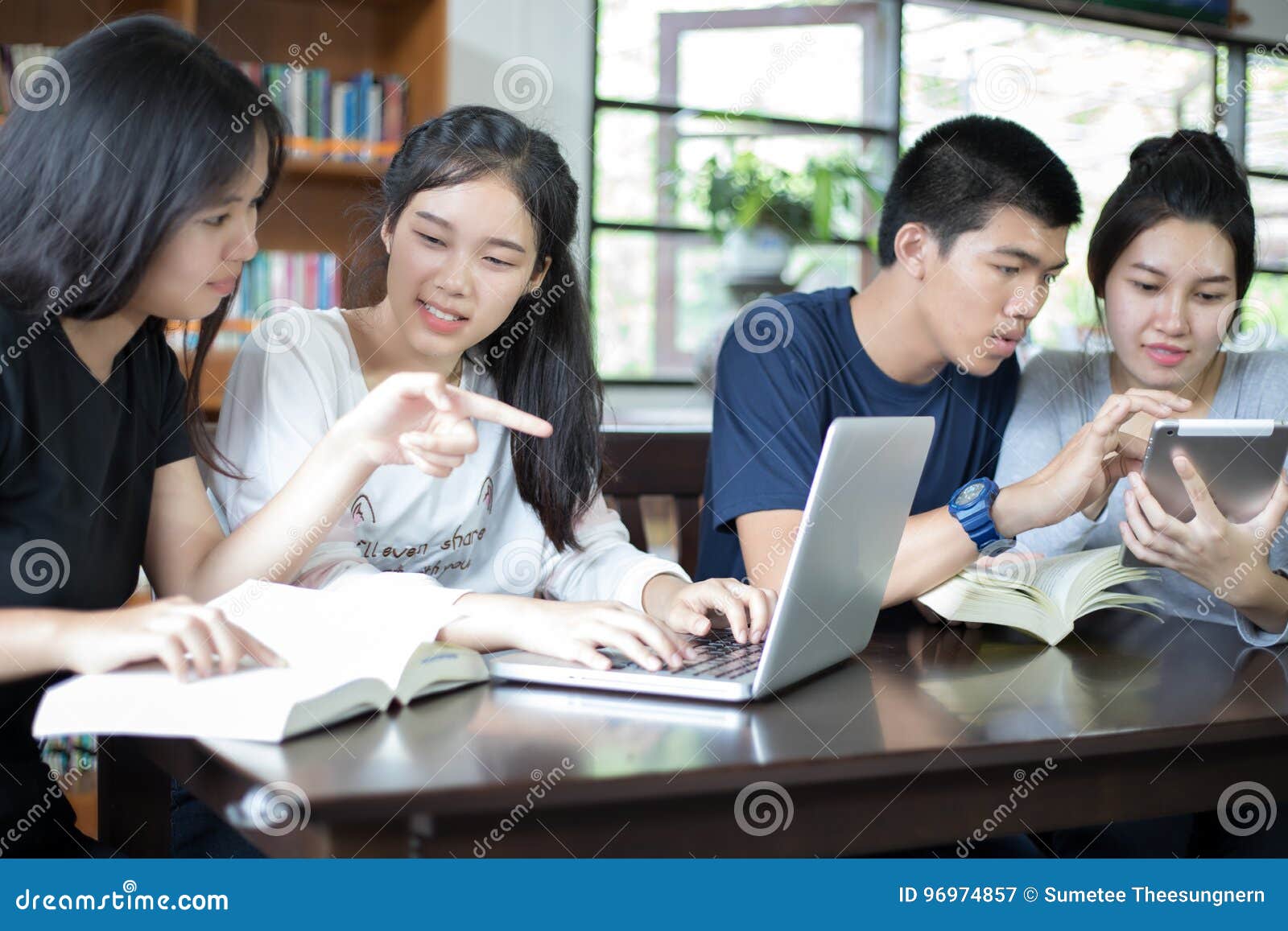 Asian Group of Students Sharing with the Ideas for Working on Th Stock ...