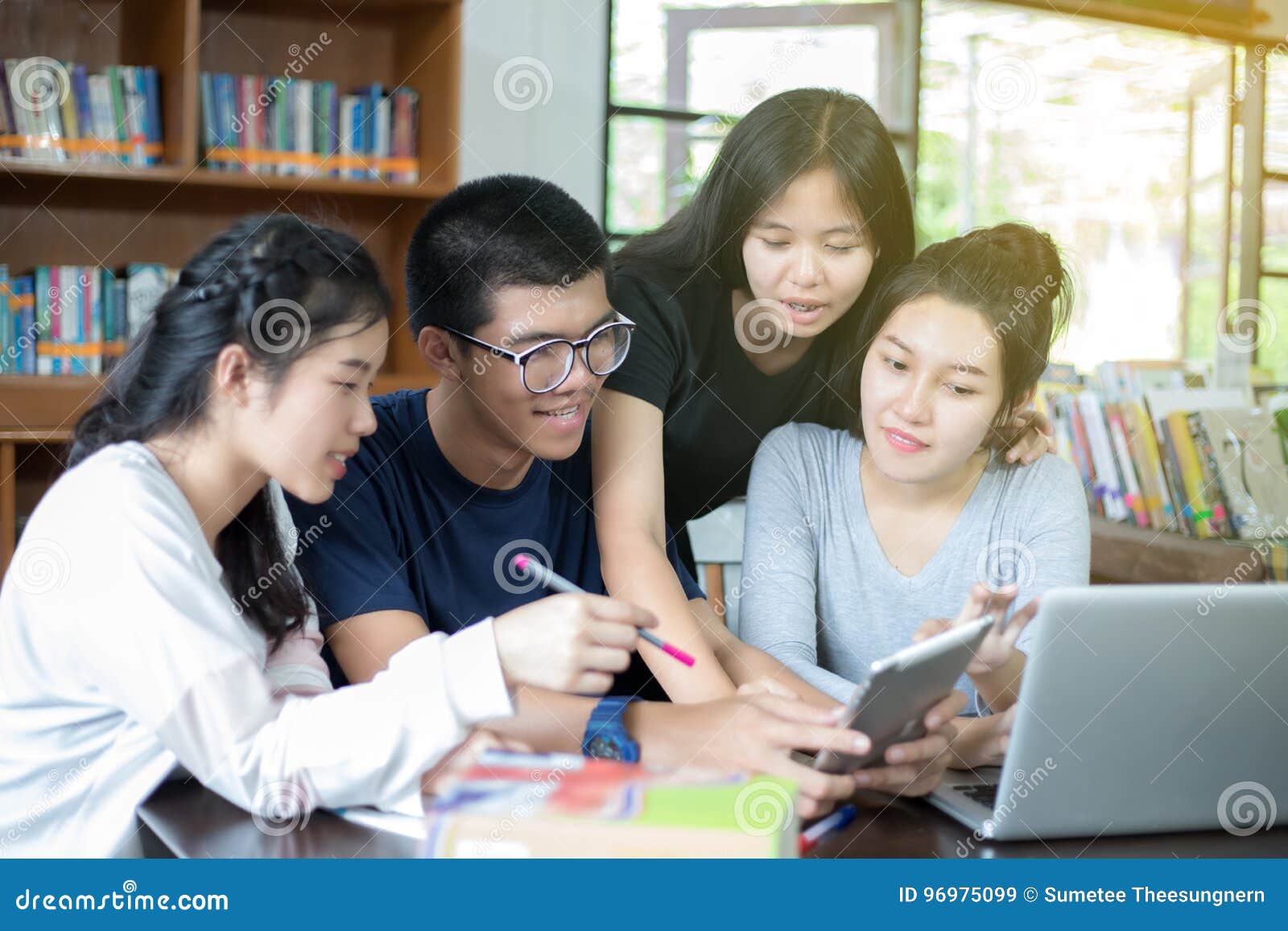 Asian Group of Students Sharing with the Ideas for Working on Th Stock ...