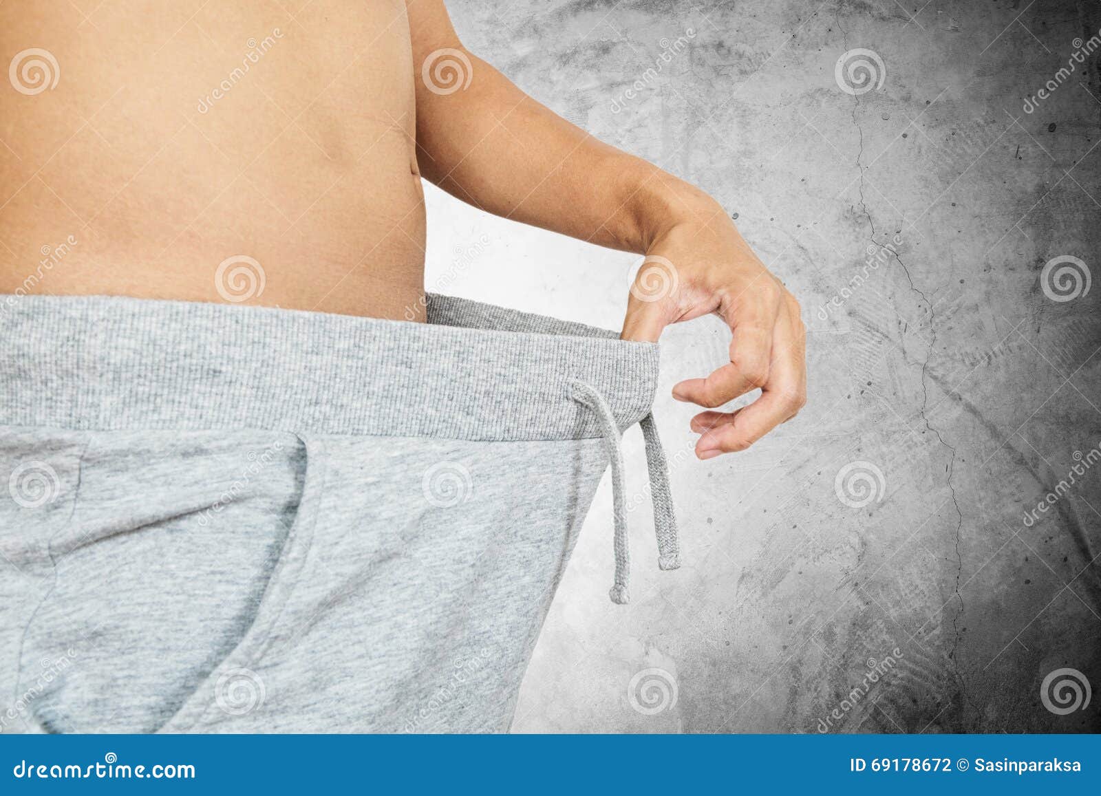 Asian Guy Pulling Warm Pant, Abstract Concept, on Concrete Background ...