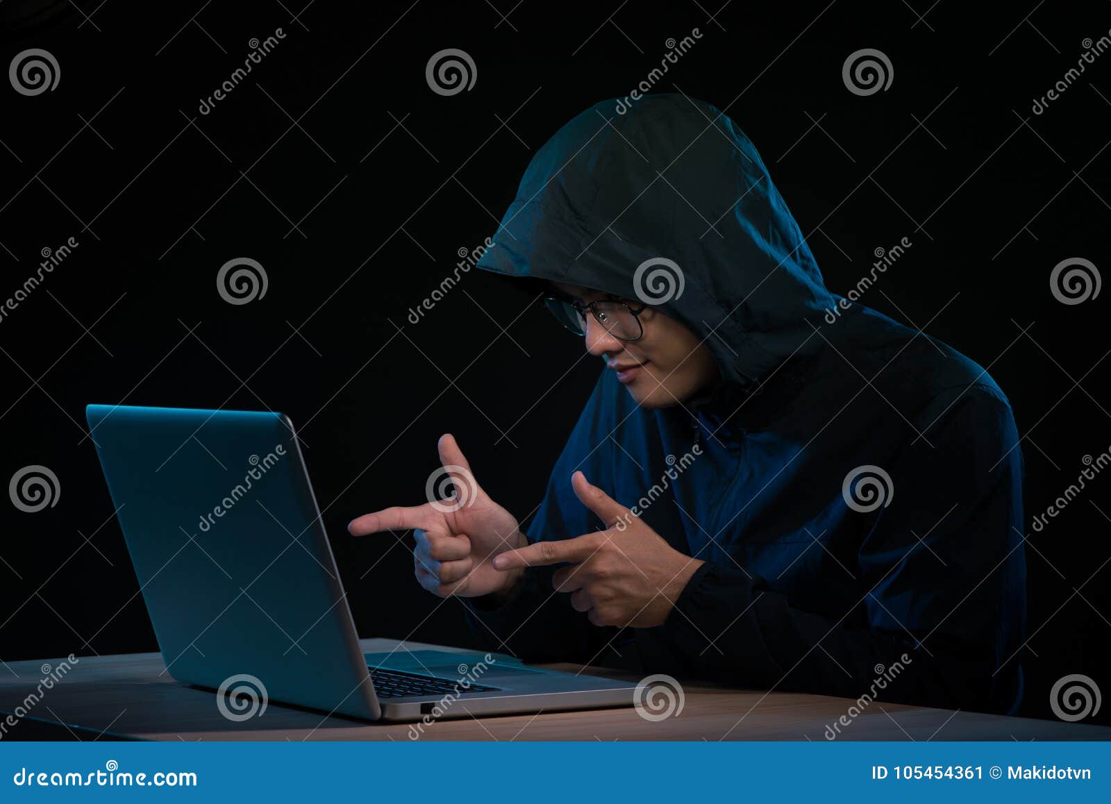 Asian Hacker Hacking Computer Network with Laptop in Dark. Cyber ...
