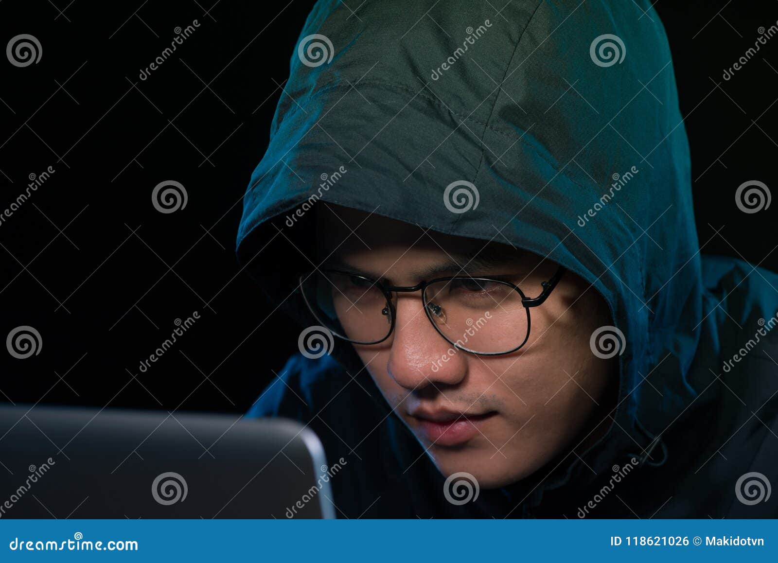Asian Hacker Hacking Computer Network with Laptop in Dark. Cyber ...