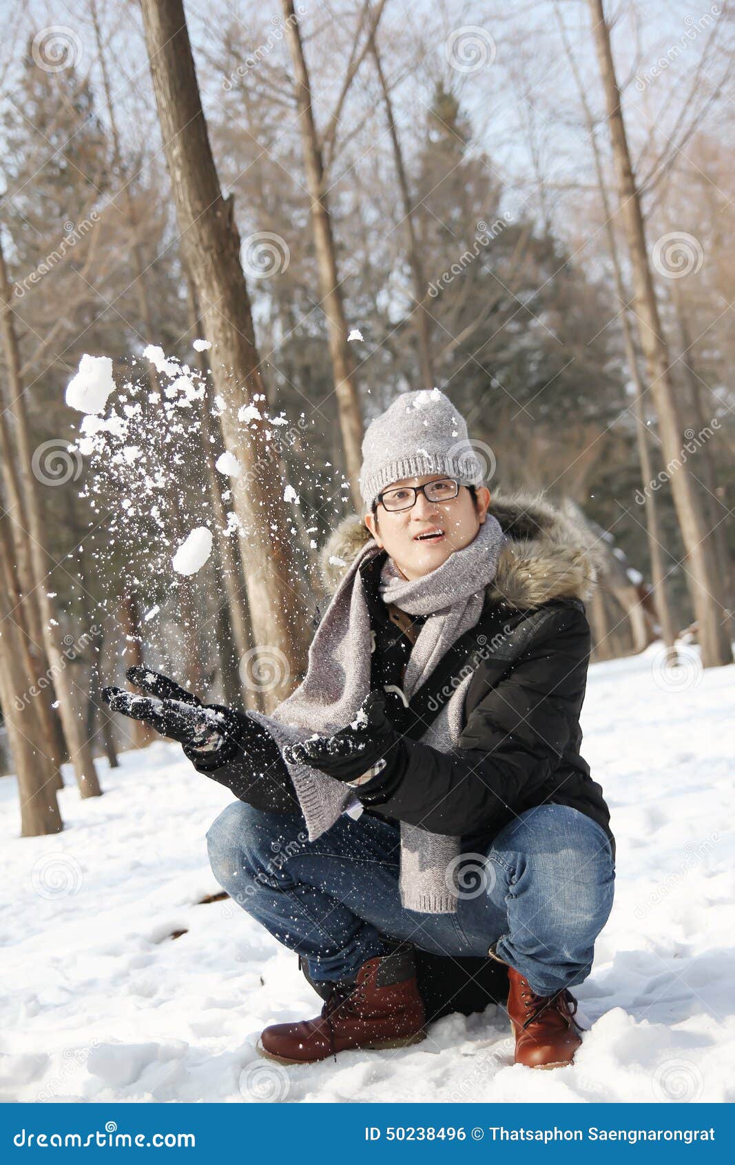 Asian Handsome Guy Throwing Snow in the Air in Garden Stock Photo ...