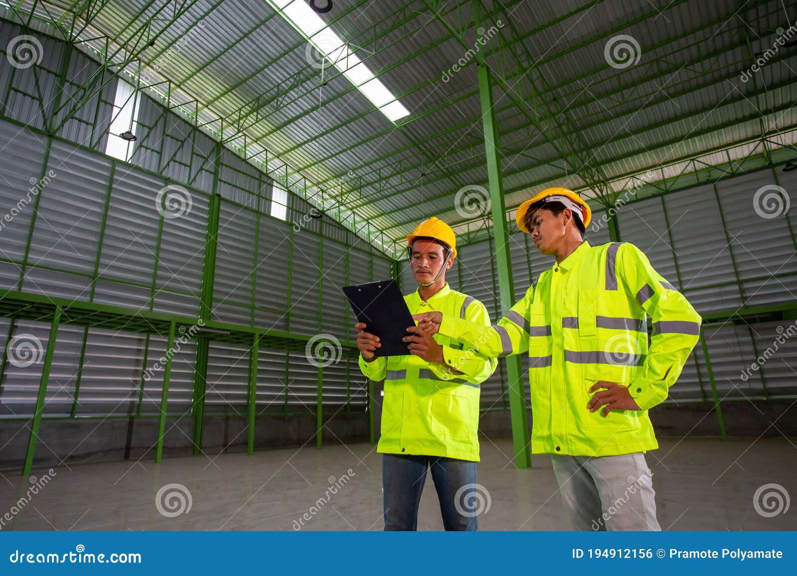 Asian Industrial Engineer in Hard Hat Wearing Safety Jacket Plan Work ...