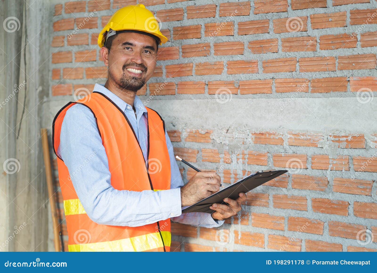 Asian Inspector Checking Structure of New Property and Taking Note in ...