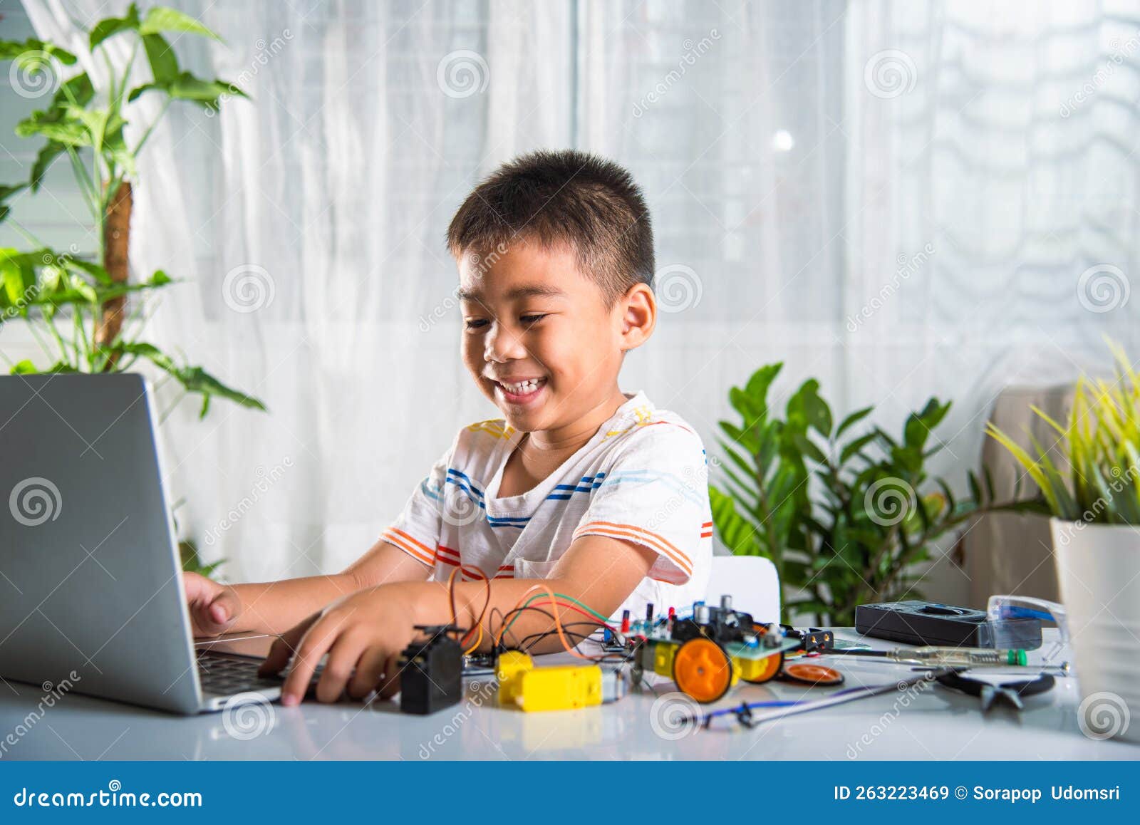 Asian Kid Boy Learns Coding and Programming with Laptop for Arduino ...