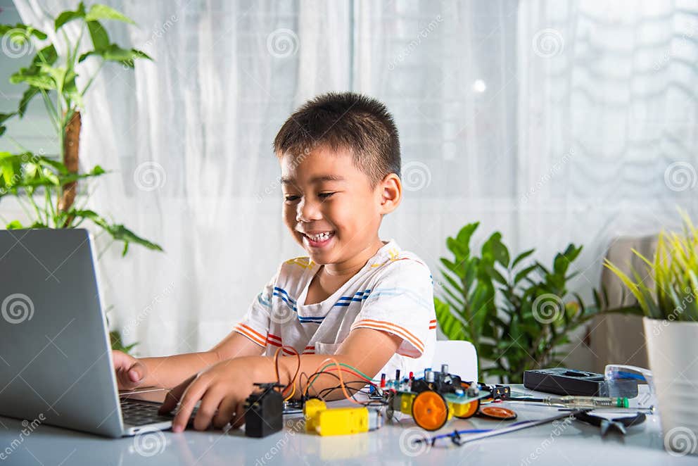 Asian Kid Boy Learns Coding and Programming with Laptop for Arduino ...