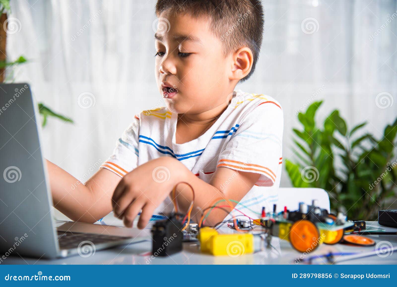 Asian Kid Boy Learns Coding and Programming with Laptop for Arduino ...