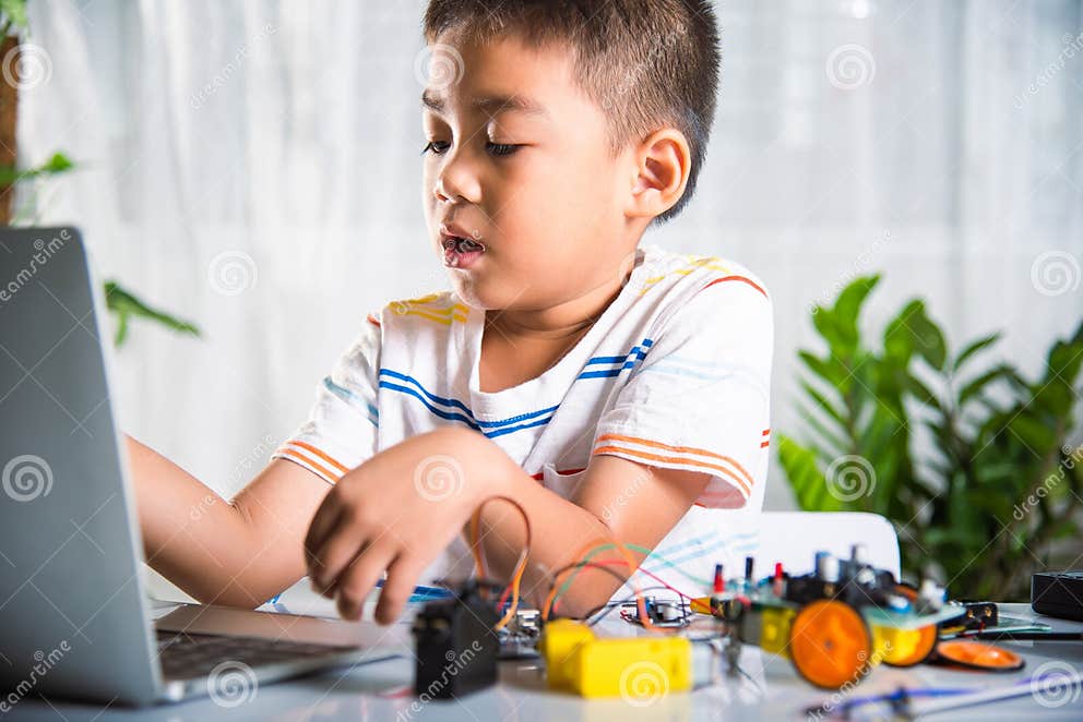 Asian Kid Boy Learns Coding and Programming with Laptop for Arduino ...