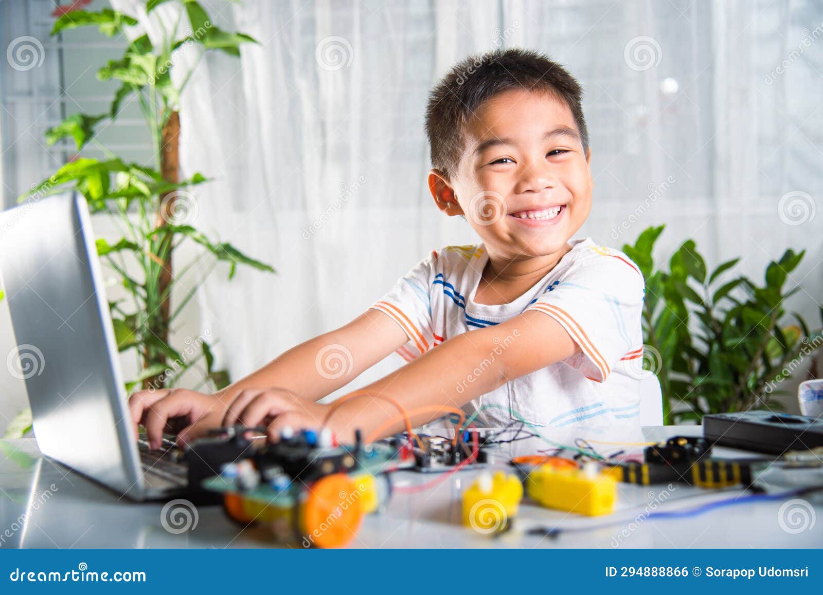 Asian Kid Boy Learns Coding and Programming with Laptop for Arduino ...