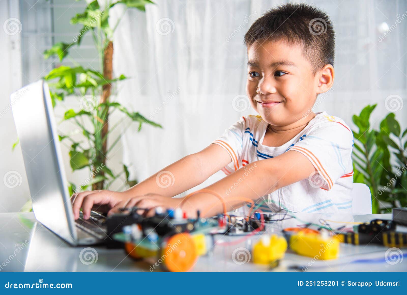 Asian Kid Boy Learns Coding and Programming with Laptop for Arduino ...