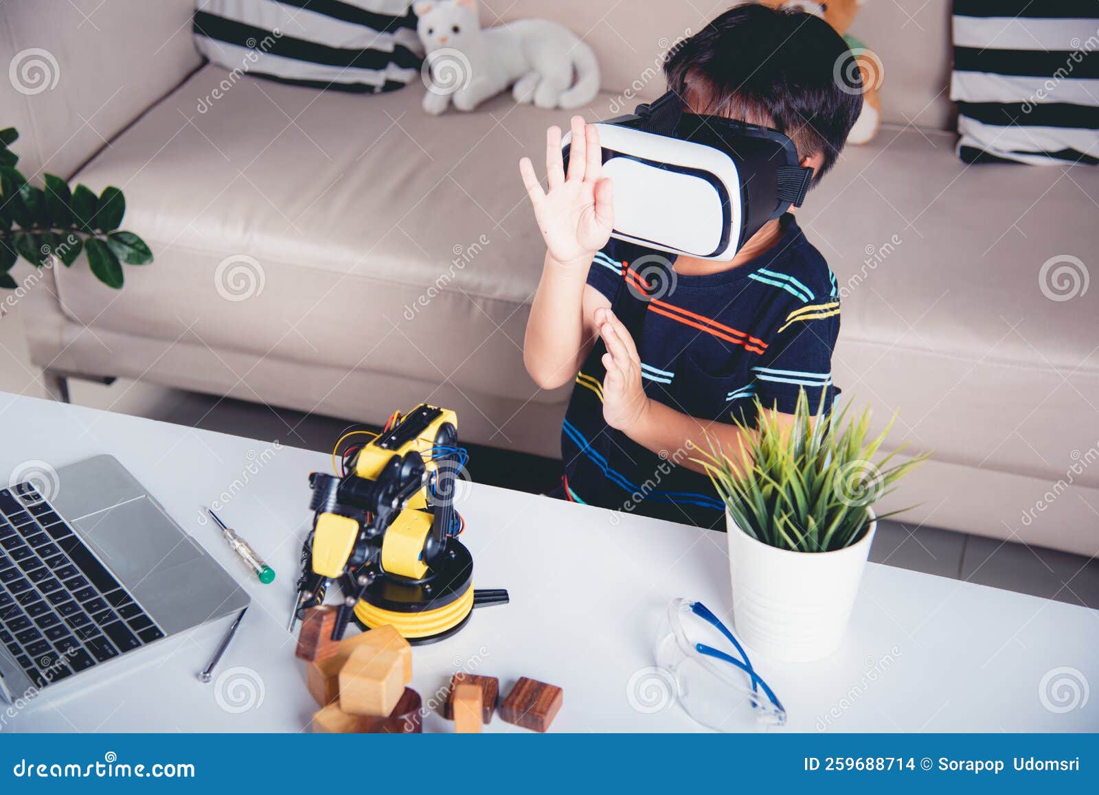 Asian Kid Boy Using VR Glasses on Robotic Arm in Workshop Stock Photo ...
