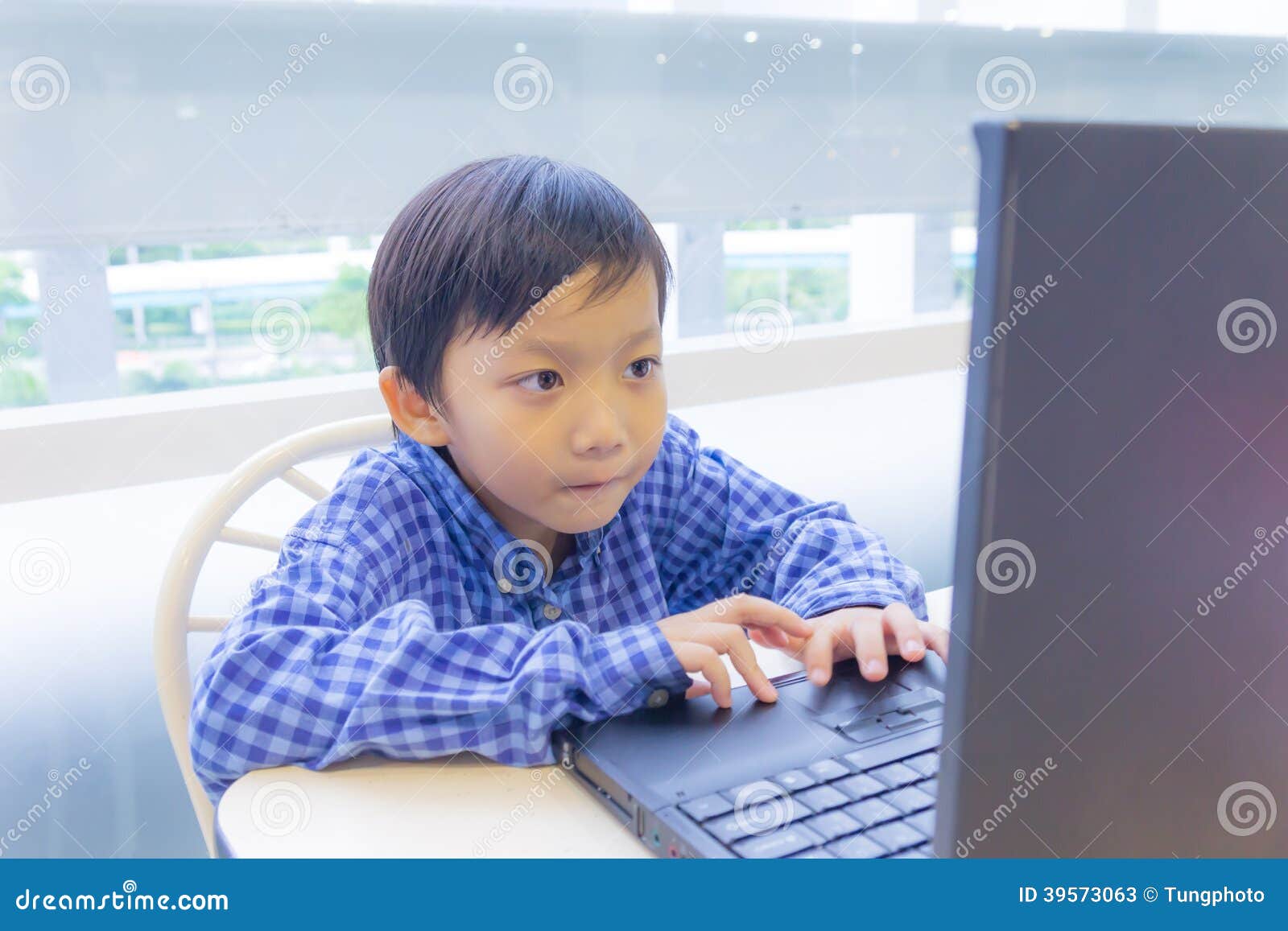 Asian kid with laptop stock image. Image of delighted - 39573063