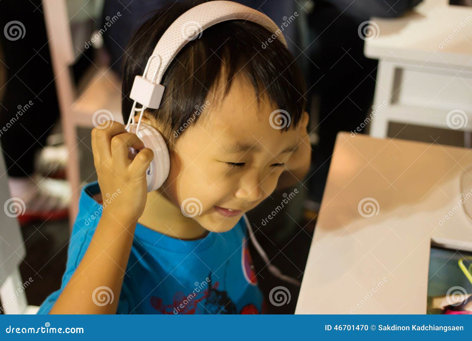 Asian Kid Play Computer Internet Games and Wear Headset Stock Photo ...