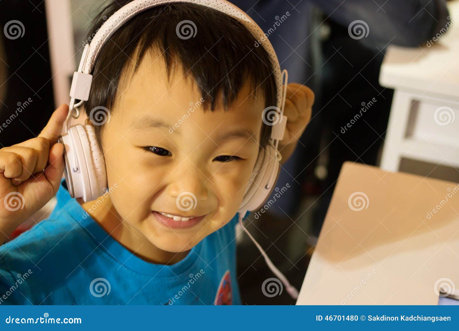 Asian Kid Play Computer Internet Games and Wear Headset Stock Photo ...