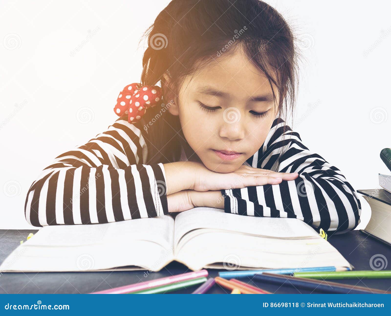 Asian kid is reading book stock photo. Image of school - 86698118