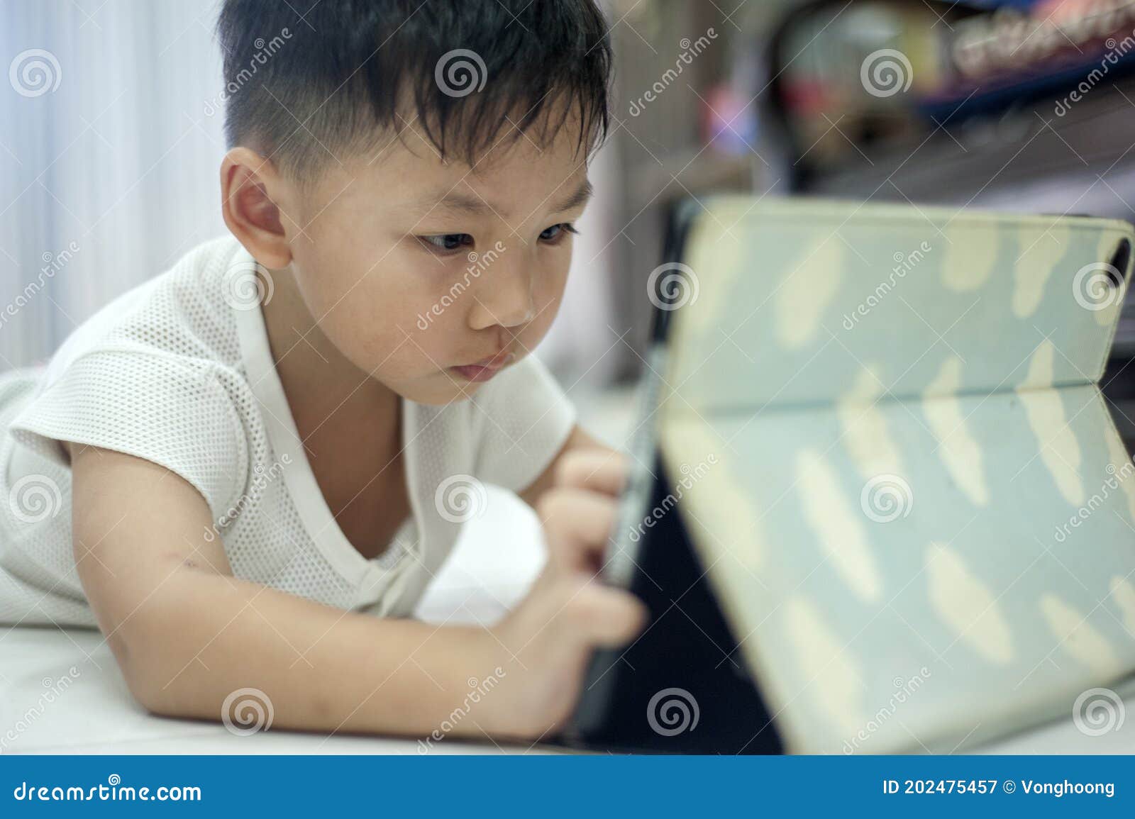 Asian Kid`s Using Digital Touchscreen Phone Tablet Computer Playing ...