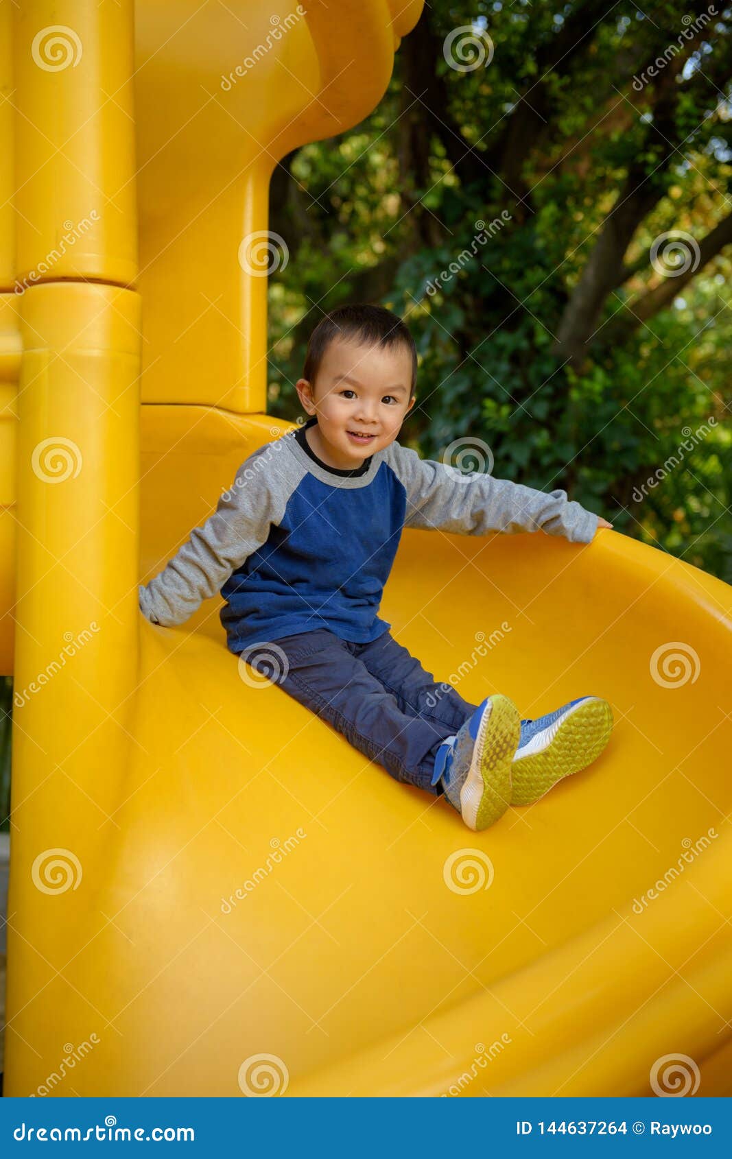 Asian kid on slide stock photo. Image of playful, people - 144637264