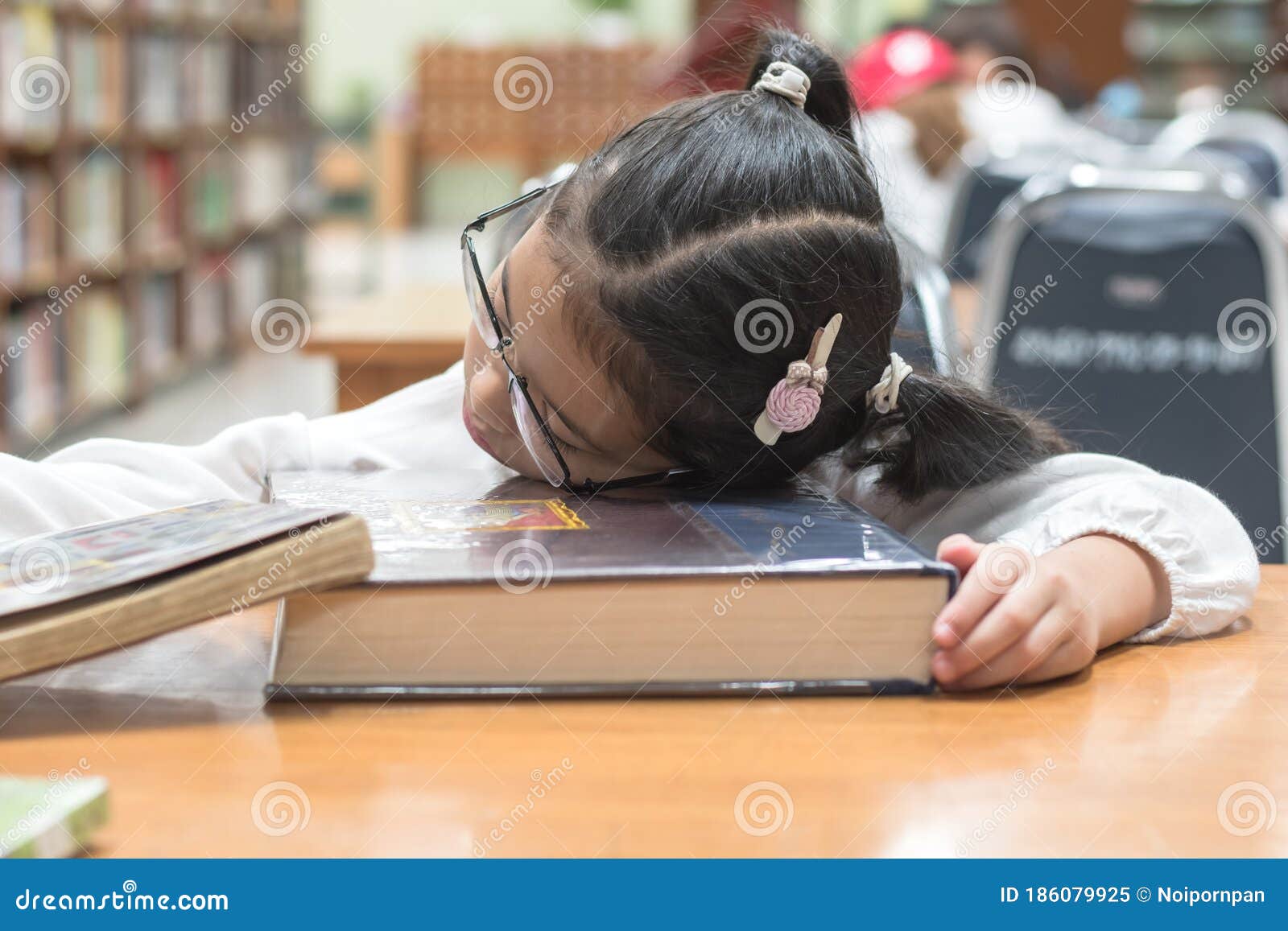 Asian Kid Student Studying Hard Feeling Tired in School Library ...