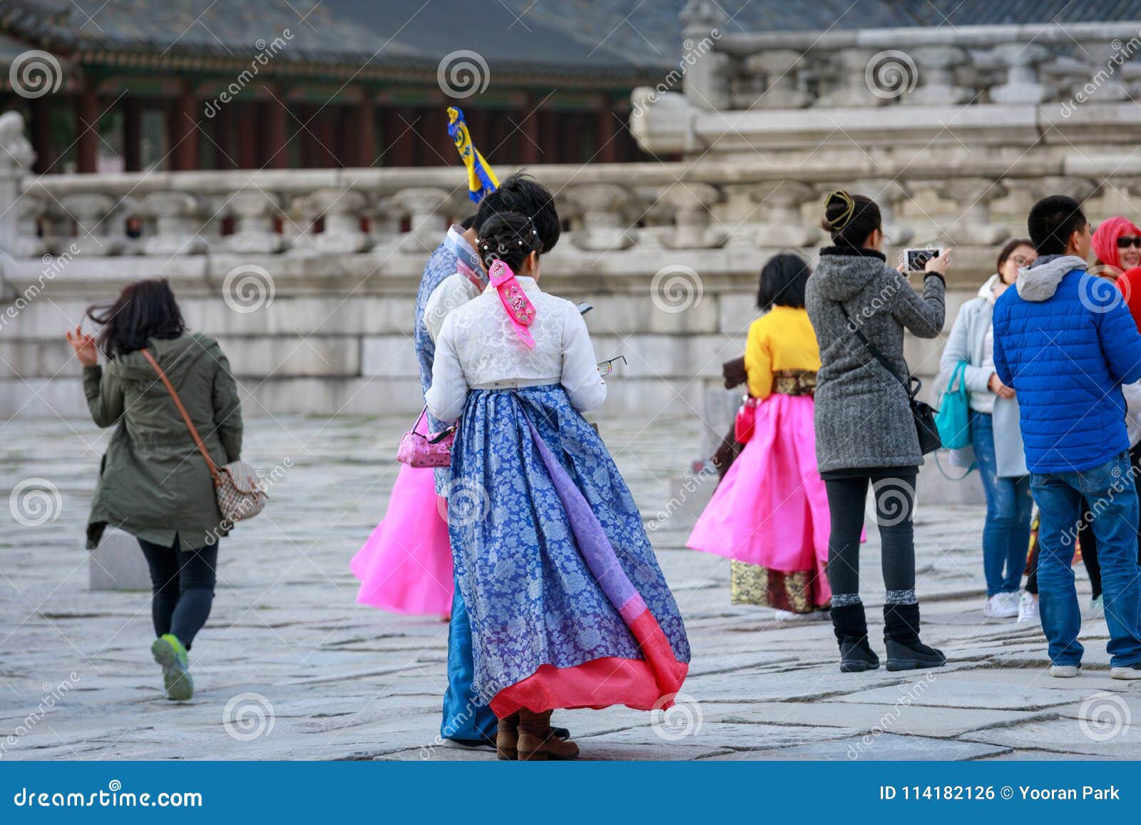 Asian Korean Woman Dressed Hanbok In Traditional Dress Walking In