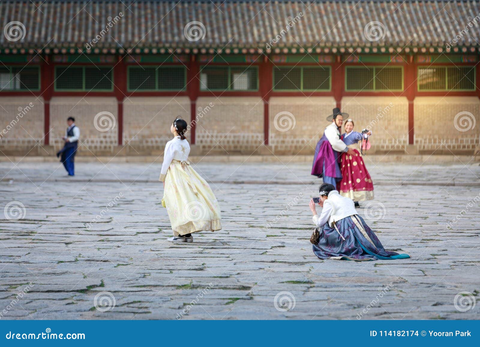 Asian Korean Woman Dressed Hanbok In Traditional Dress Walking In