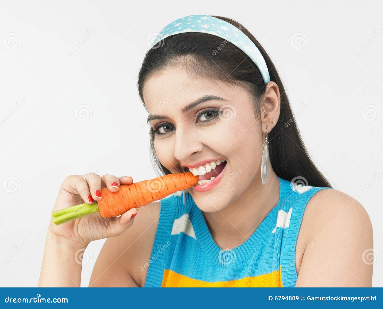Asian lady eating a carrot stock image. Image of beauty - 6794809