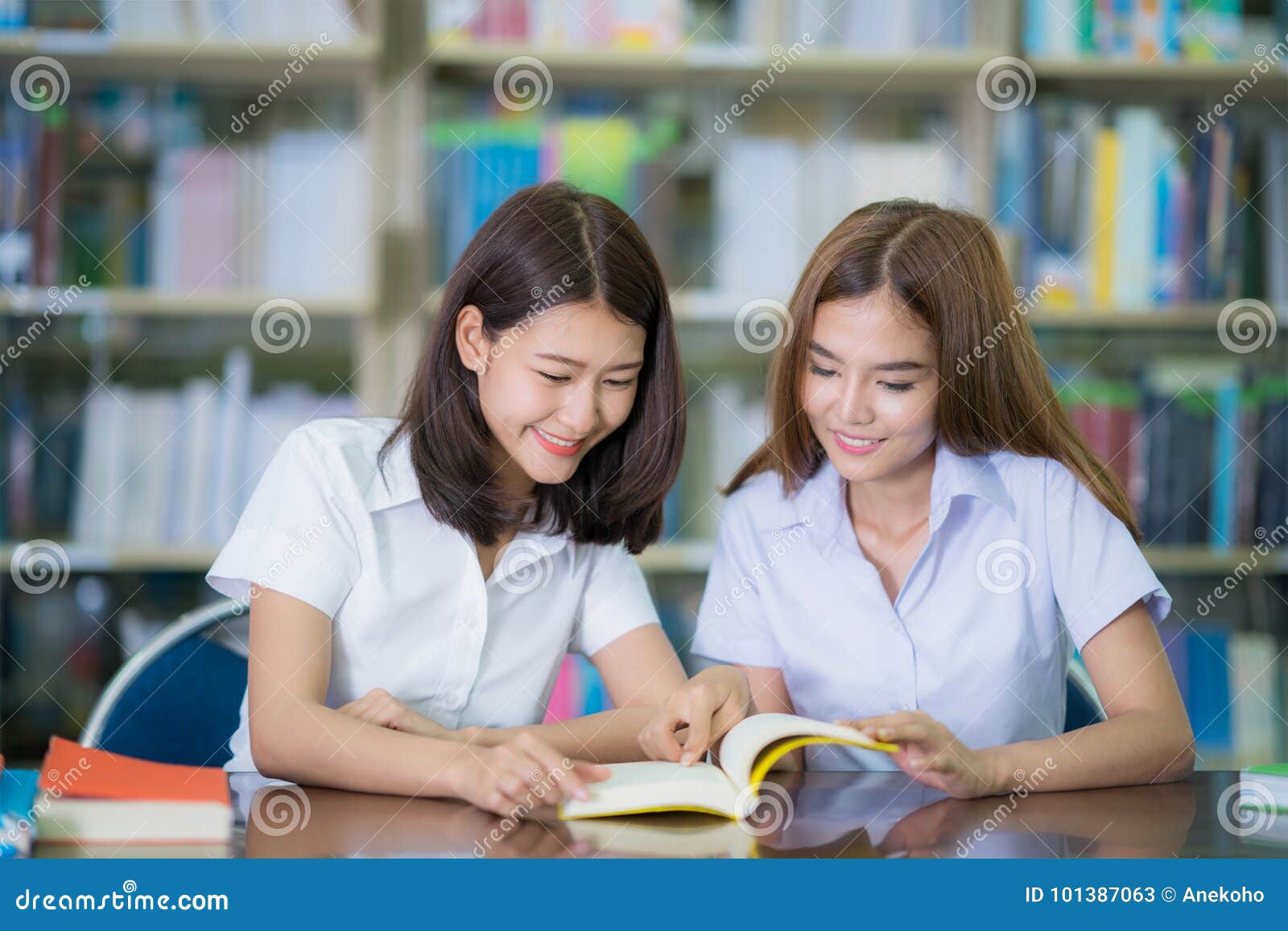 Asian Lady Student Study and Do Home Work in Library in University ...