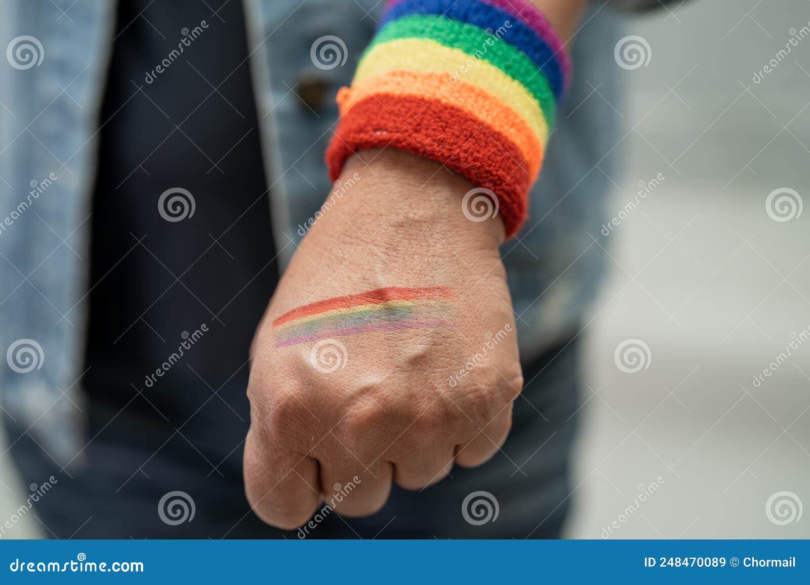 Asian Lady Wearing Rainbow Flag Wristbands Symbol Of Lgbt Pride Month