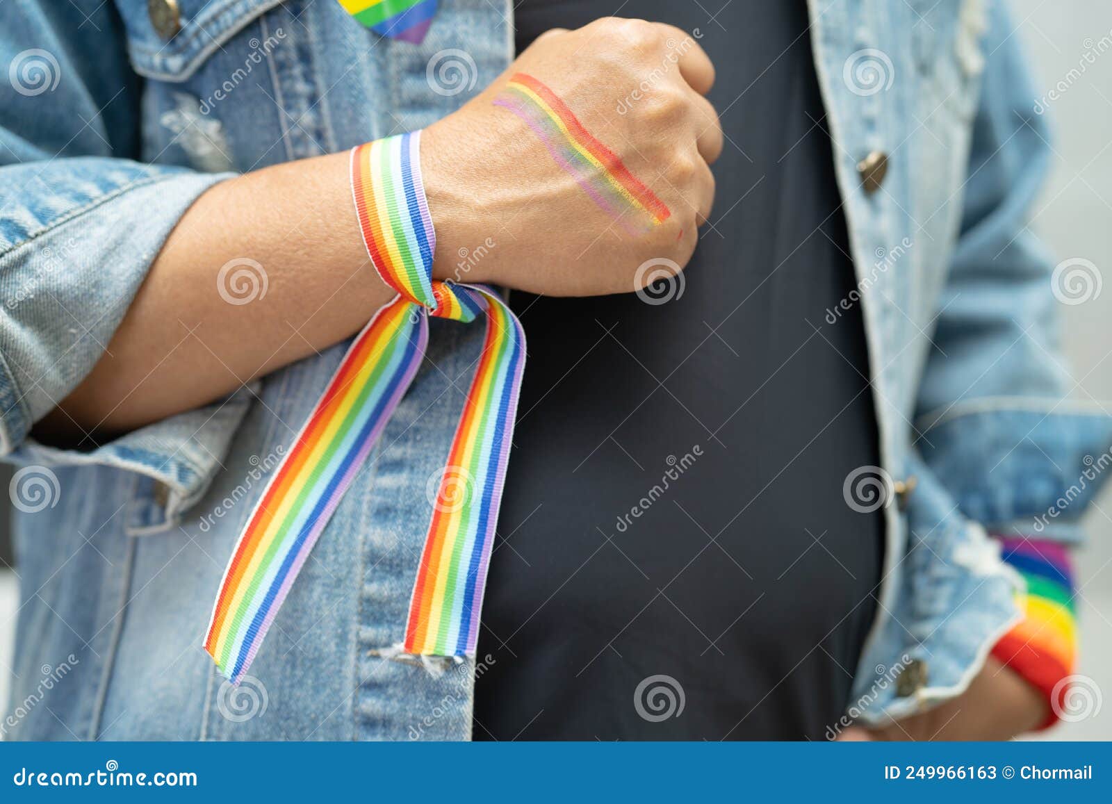 Asian Lady Wearing Rainbow Flag Wristbands Symbol Of Lgbt Pride Month