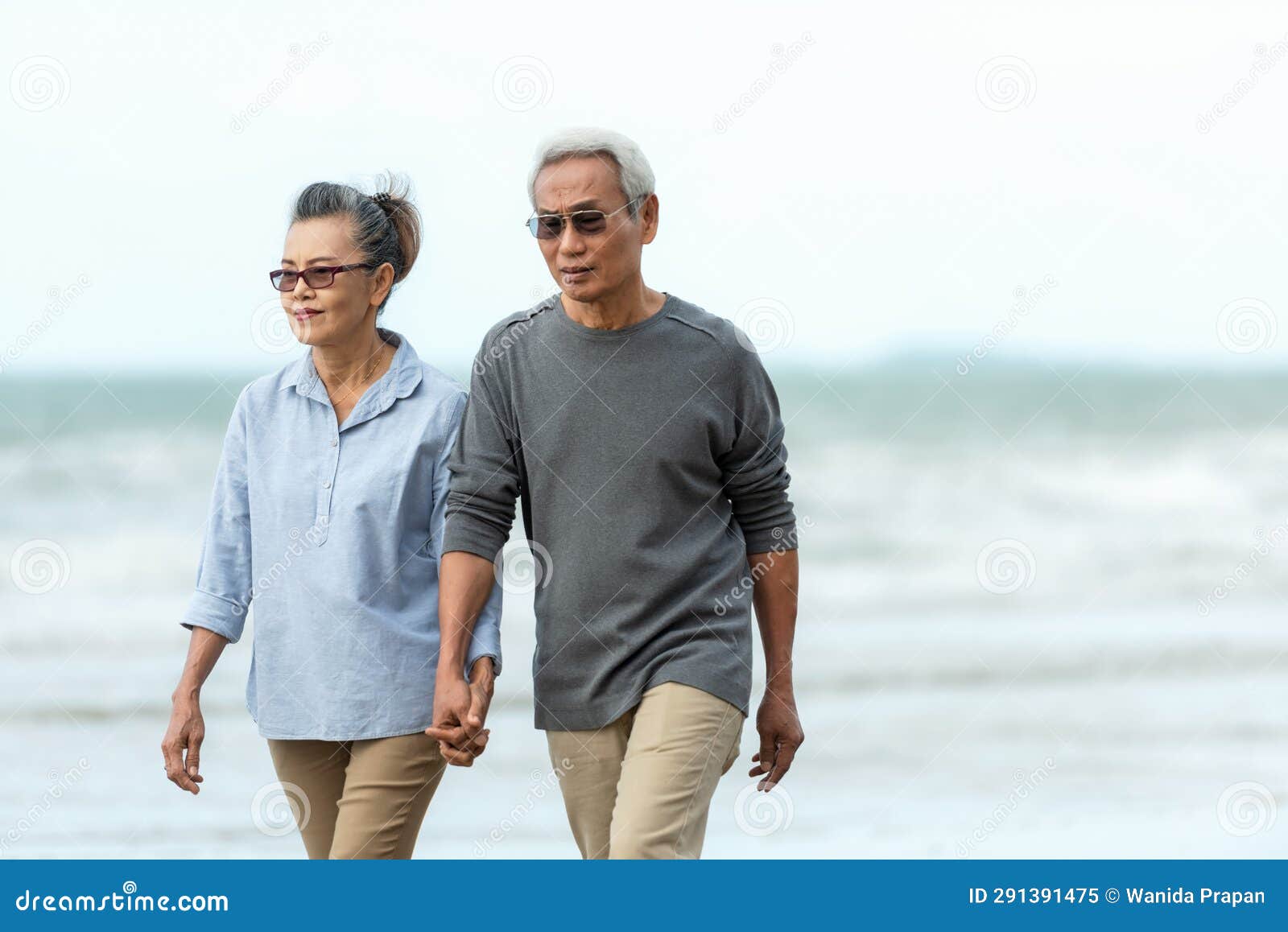 Asian Lifestyle Senior Couple Walking Chill On The Beach Happy In Love