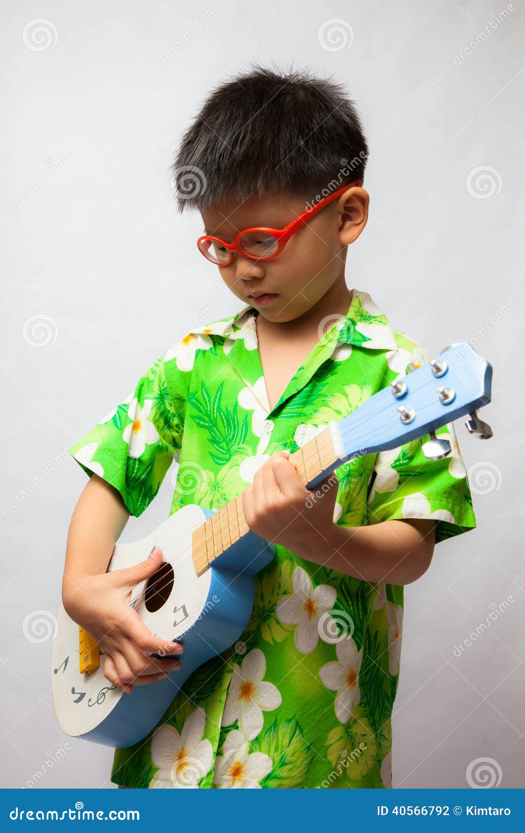 Asian Little Boy Playing Ukulele Stock Photo - Image of playing ...