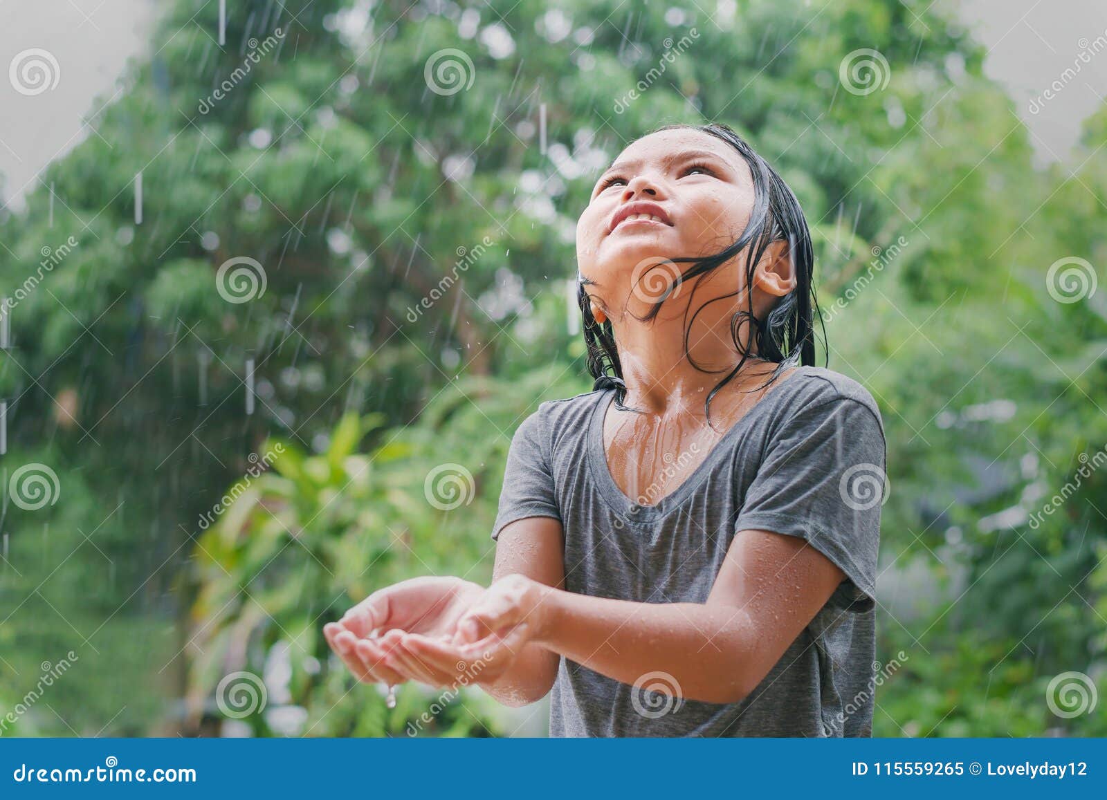 Asian little girl playing stock image. Image of rain - 115559265
