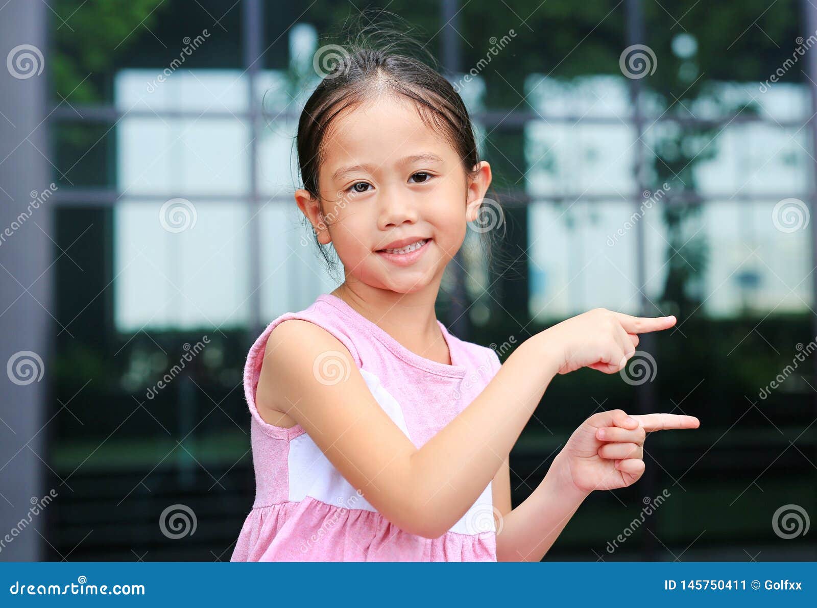 Asian Little Girl Posture Pointing Her Forefinger beside with Cute ...