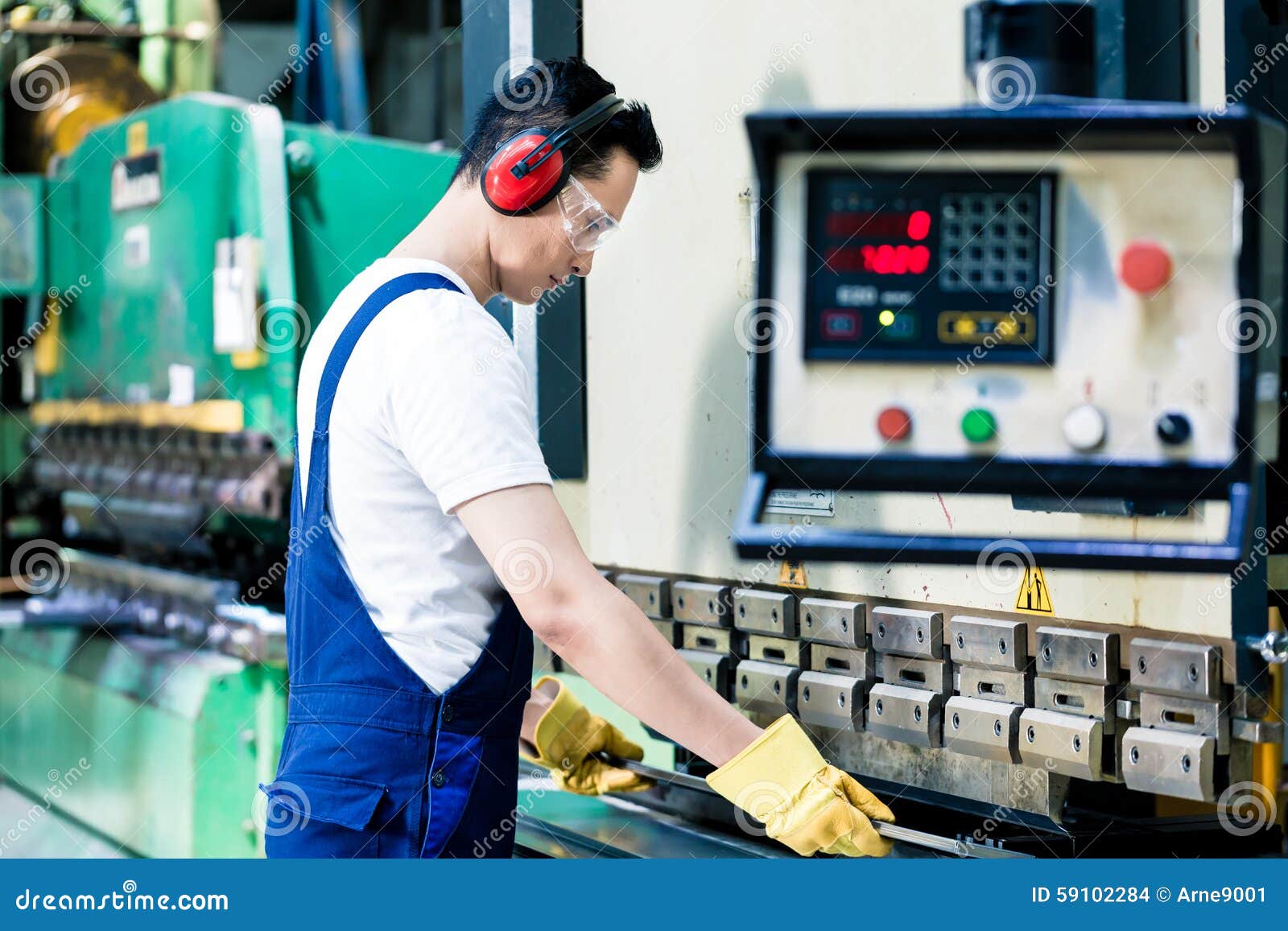 Asian Machine Operator in Production Plant Stock Photo - Image of ...