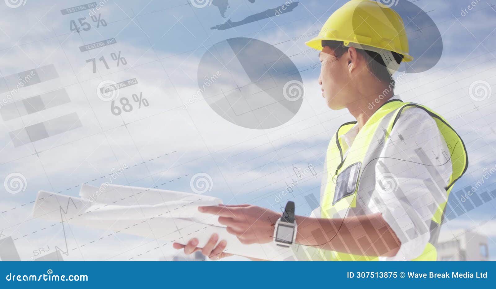 Asian Male Architect with Plans Atop a Building, Graphs in Front Stock ...