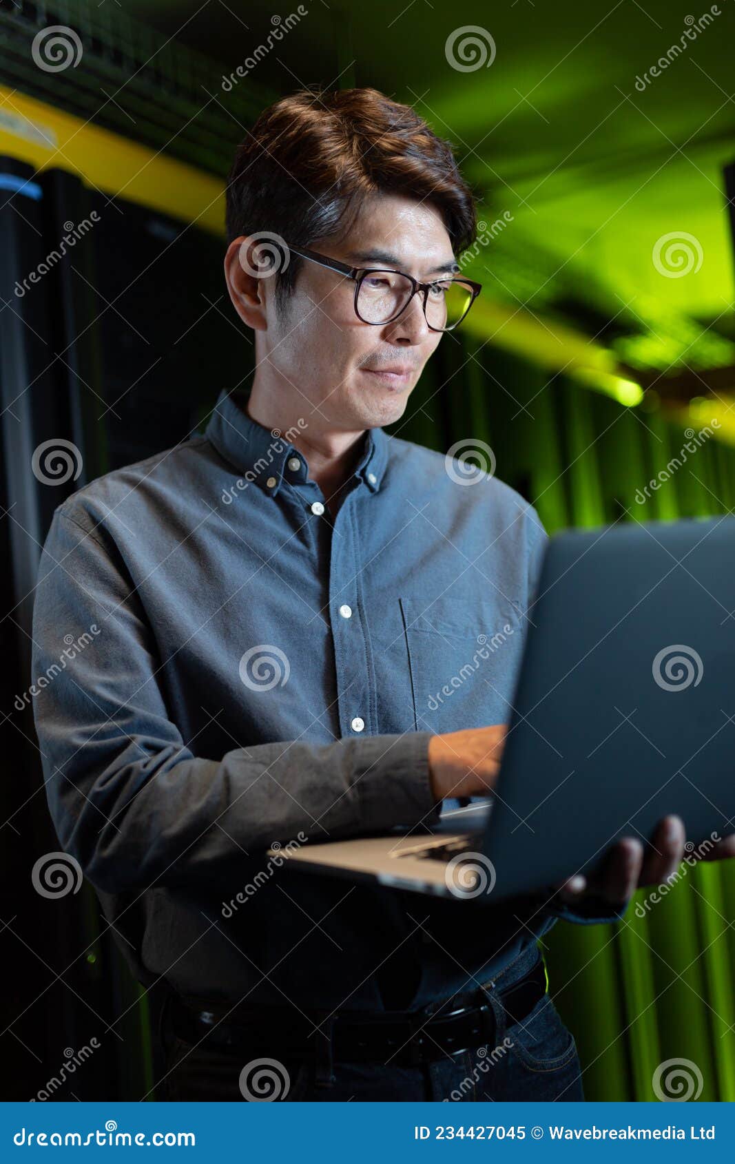 Asian Male Engineer Using Laptop in Computer Server Room Stock Image ...