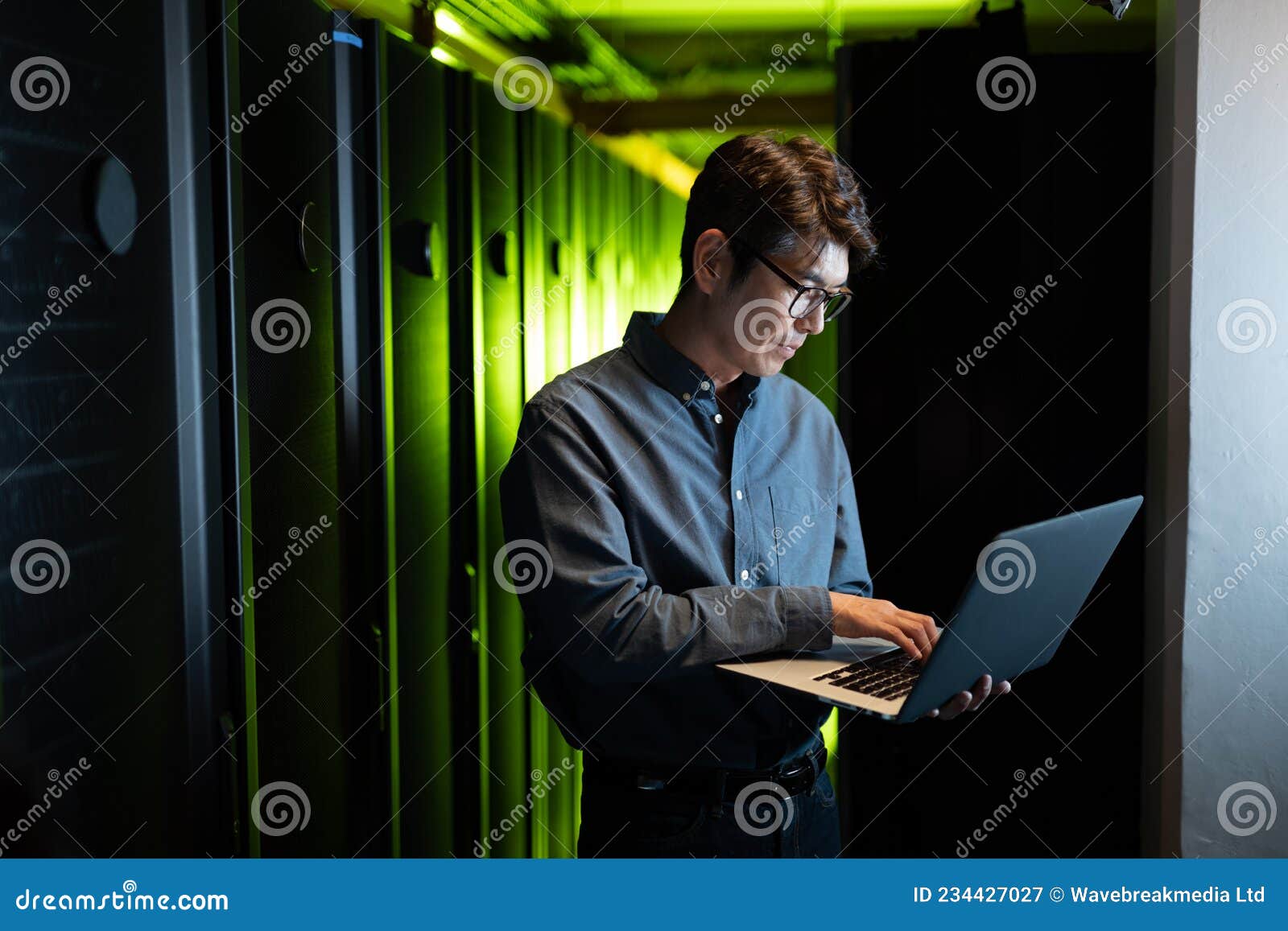 Asian Male Engineer Using Laptop in Computer Server Room Stock Image ...