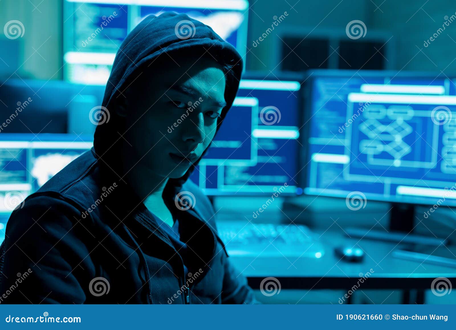 Male Hacker In A Robber Mask Uses Phone, Credit Card And Laptop In Some ...