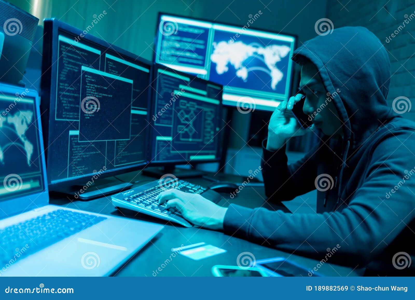 Male Hacker In Hood Holding Credit Card And Stealing Money From Online ...