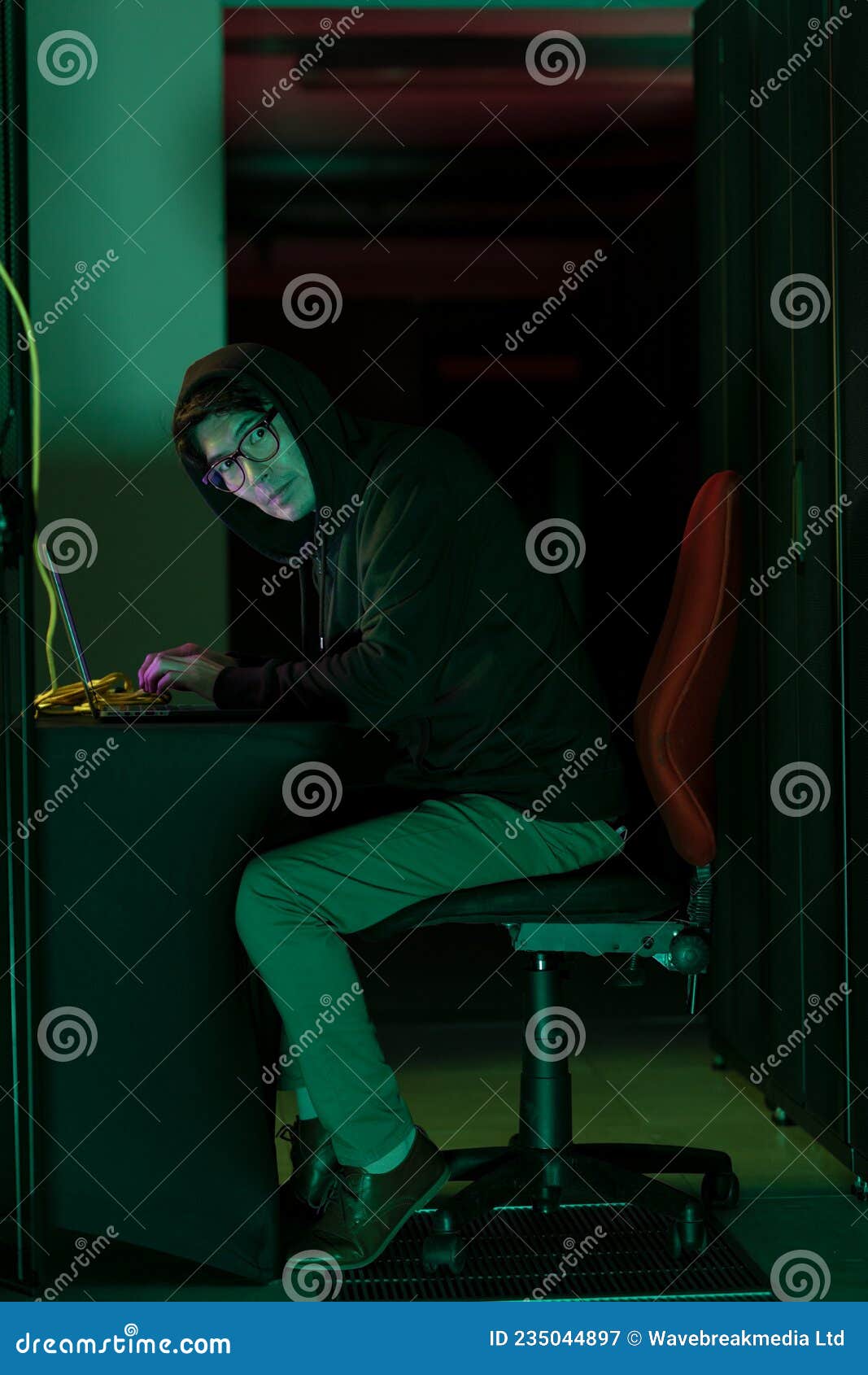 Asian Male Hacker Using a Laptop in Computer Server Room Stock Image ...