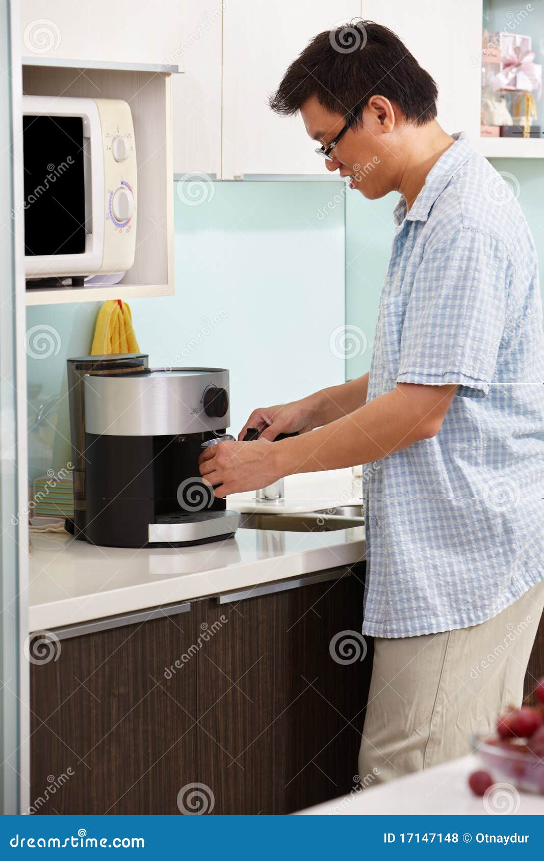 Asian male making coffee stock photo. Image of adult - 17147148