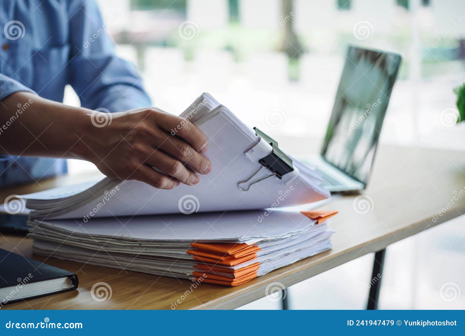 Asian Male Office Worker Holding Documents of Unfinished Paperwork on ...
