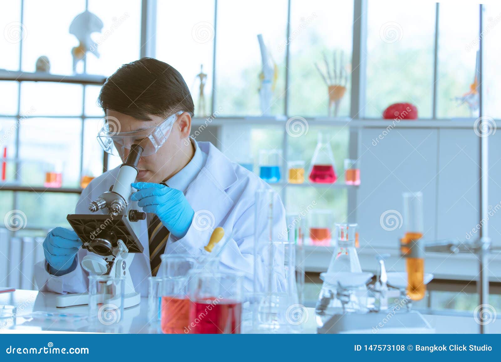Scientist Adjusting Microscope for Experiment Stock Photo - Image of ...
